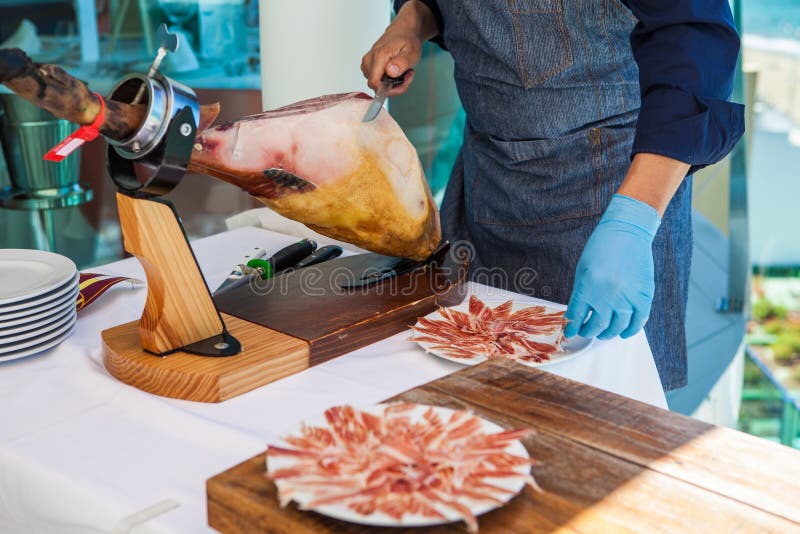 Man cutting ham stock photo. Image of meat, gourmet - 144907256