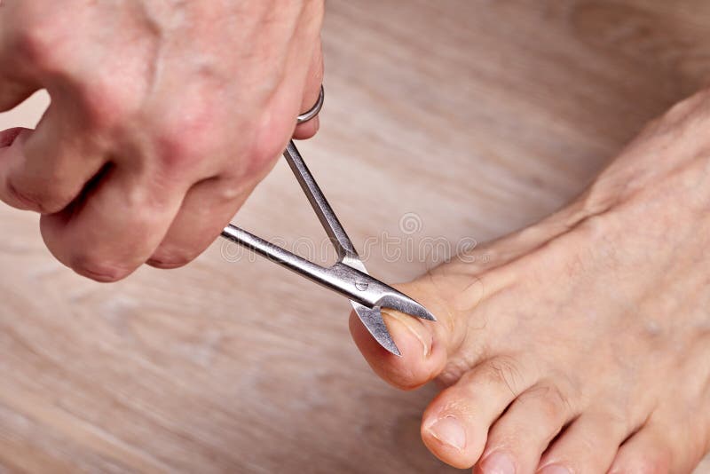 Man Cuts Nails while Makes Himself Pedicure. Stock Photo - Image of ...