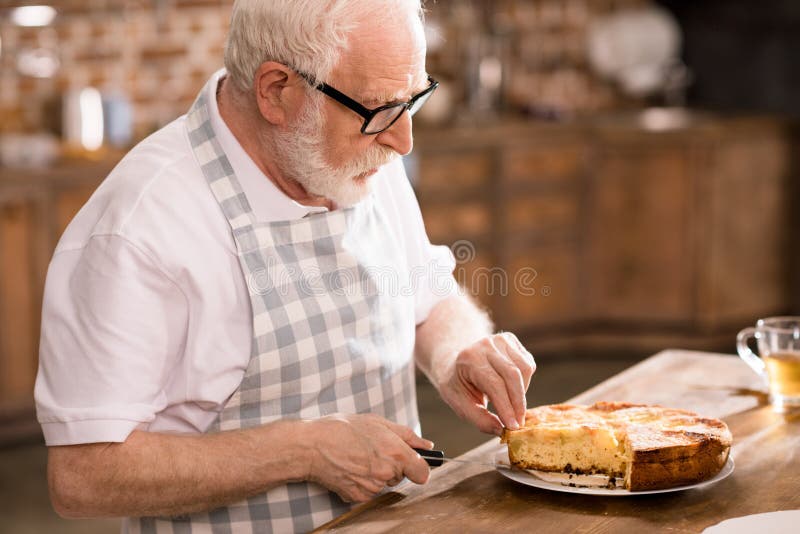 Man cutting homemade pie stock image. Image of people - 93469339