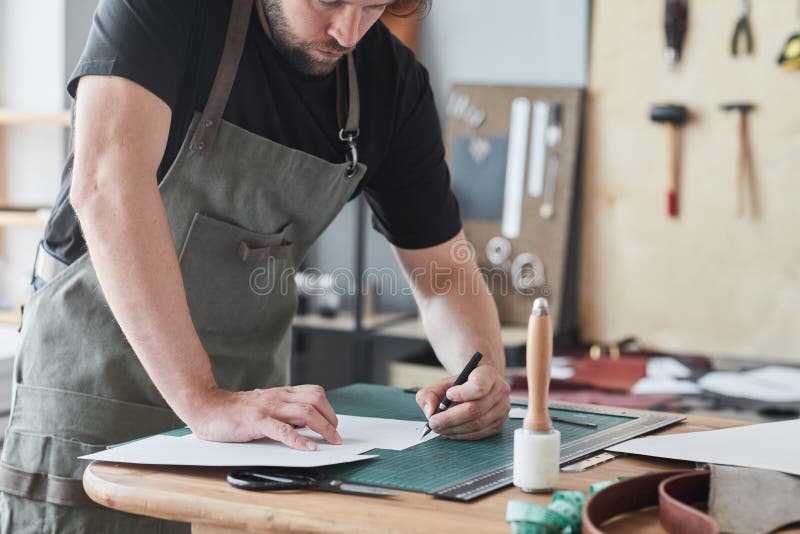 Man Cutting Leather Patterns Stock Image - Image of studio, equipment ...