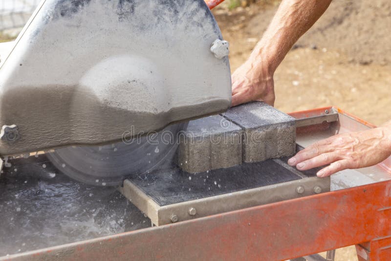 Worker with a Cutting Machine Cuts a Concrete Curb Stock Photo - Image ...