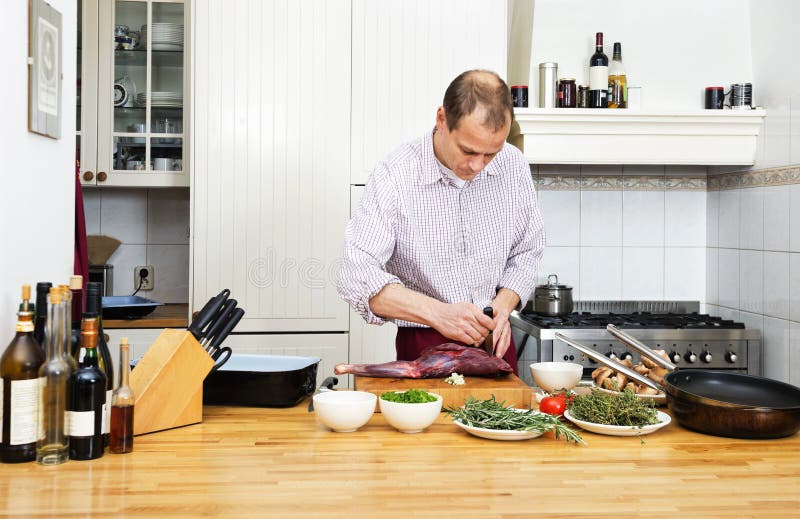 Man Cutting Meat on Chopping Board Stock Photo - Image of bottle, meat ...