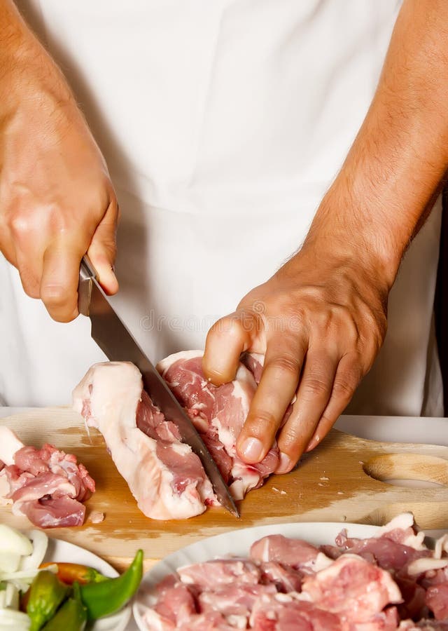 Man cutting meat stock photo. Image of domestic, preparation - 46101264