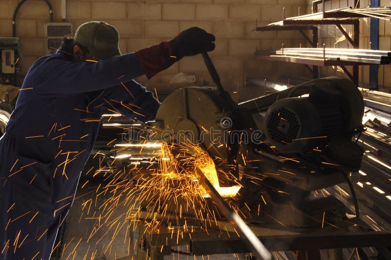 Man cutting metal stock image. Image of manufacturing - 93776031