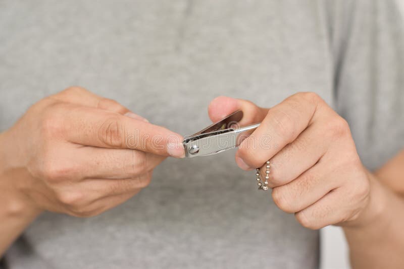 Man Cutting Nails Using Nail Clipper Stock Photo - Image of hygiene ...