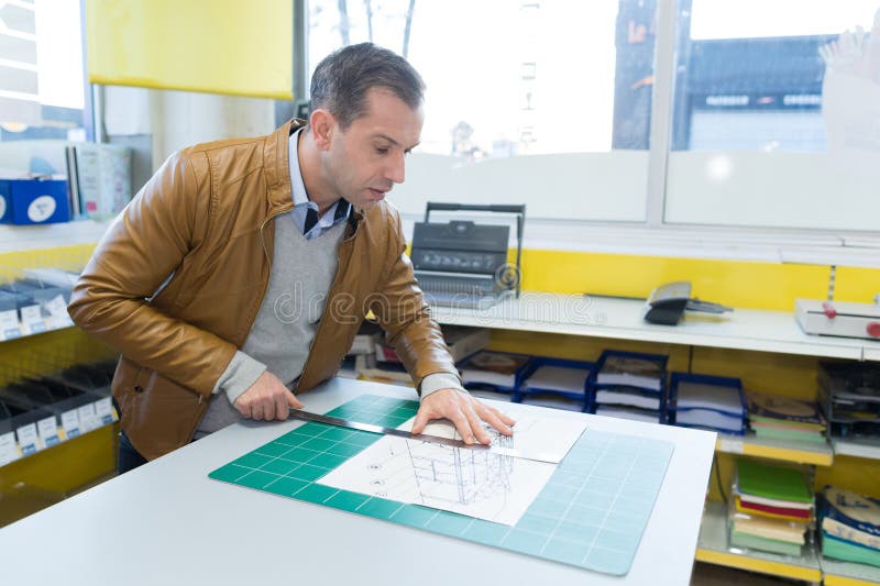 Man cutting paper manually stock image. Image of decoration - 281403023