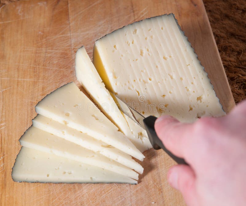 Man Cutting a Piece of Spanish Cheese Stock Image - Image of ingredient ...