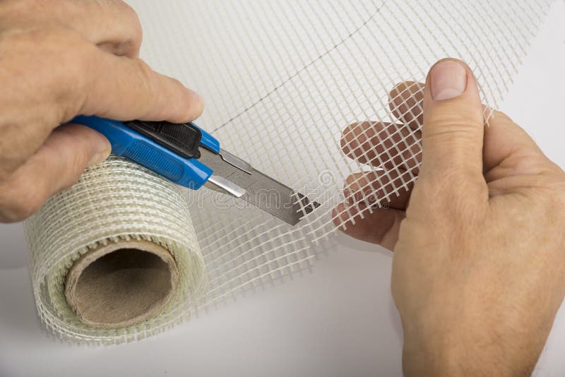 Man is Cutting a Plaster Construction Net Stock Photo - Image of ...