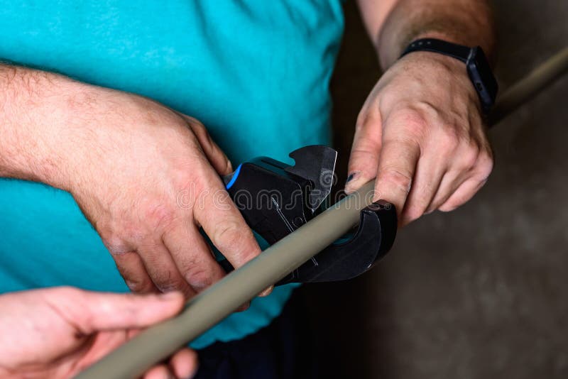 Man Cutting Plastic Pipe Watering Pipes Using Professional Scissors ...