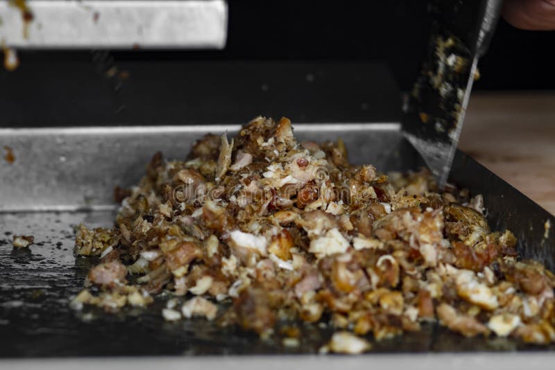 Man cutting prepared meat stock photo. Image of grill - 266400946