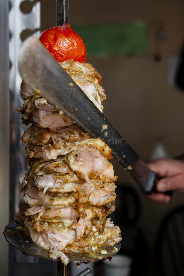 Man cutting prepared meat stock image. Image of lunch - 266400773