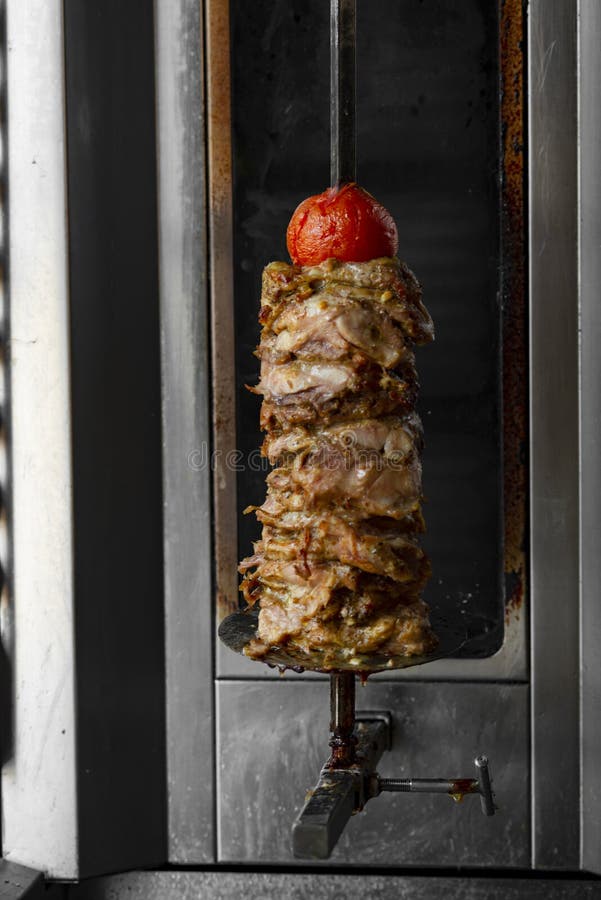 Man cutting prepared meat stock photo. Image of dinner - 266400812