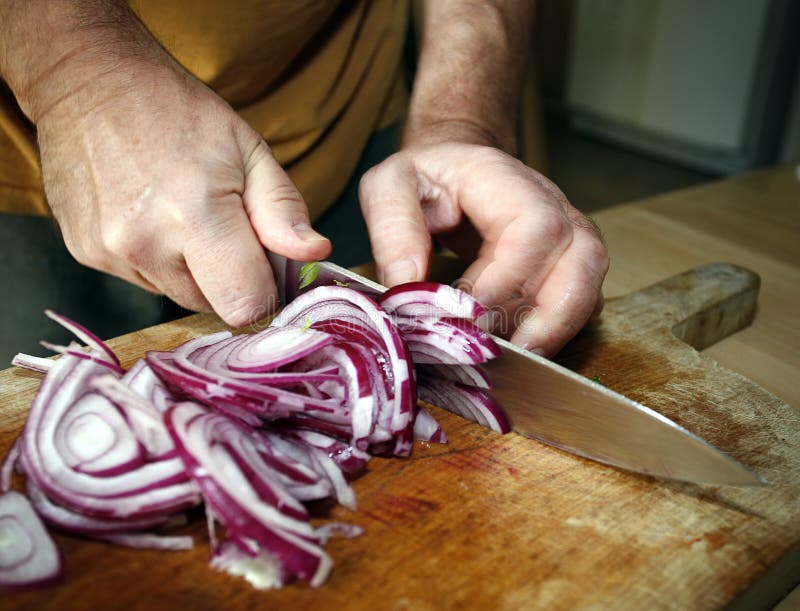 Man cutting red onion stock photo. Image of table, food - 30925054