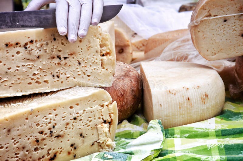 Man Cutting a Slice of Cheese Stock Photo - Image of yummy, cutting ...