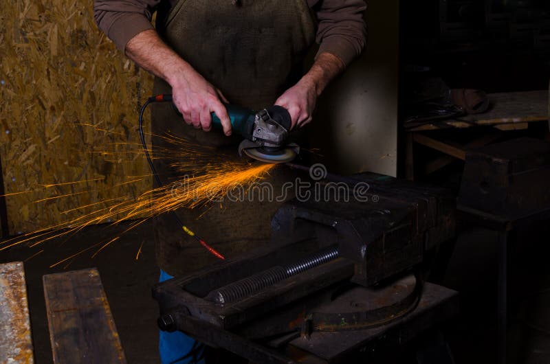 Man Cutting Steel by Grinder in Forge. Stock Image - Image of safety ...