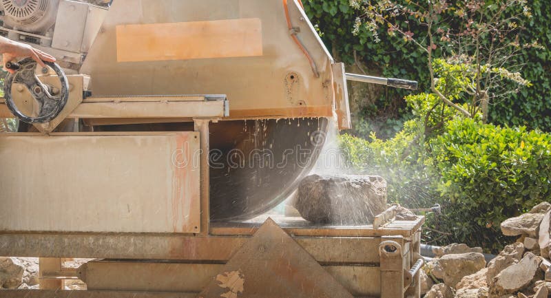 Man Cutting a Stone with a Water Saw Stock Photo - Image of powerful ...