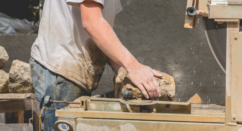 Man Cutting a Stone with a Water Saw Stock Photo - Image of factory ...