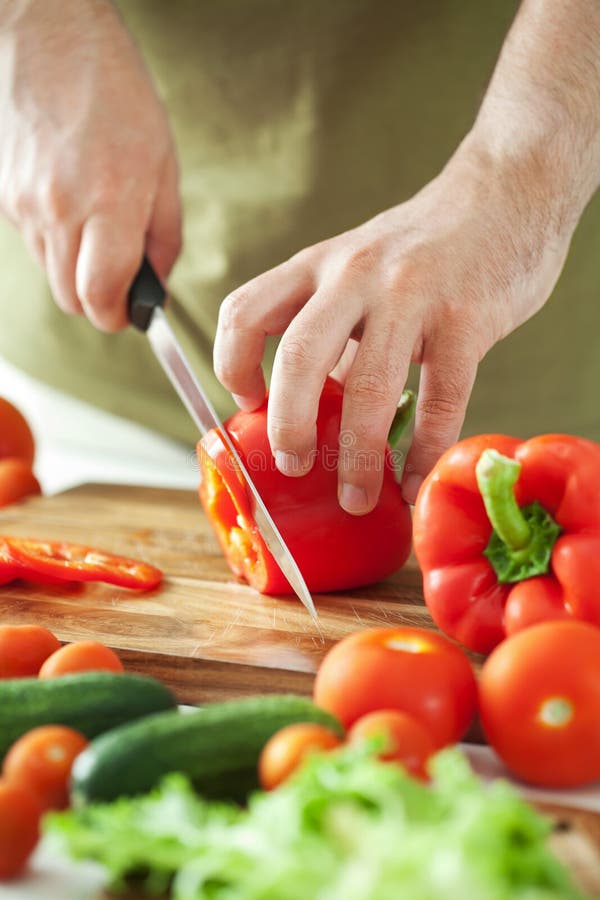 Man cutting vegetables stock photo. Image of closeup - 20485414