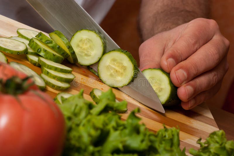 Man cutting vegetables stock photo. Image of cuts, health - 53217924