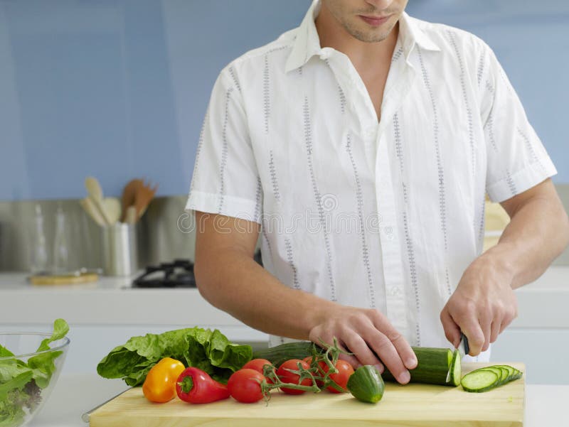 Man Cutting Vegetables in Domestic Kitchen Stock Image - Image of knife ...