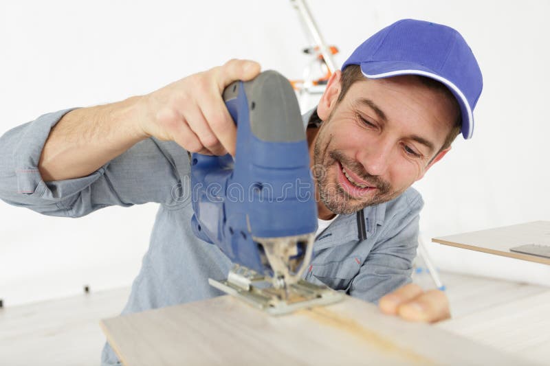 Man cutting wood stock image. Image of manual, equipment - 289725685