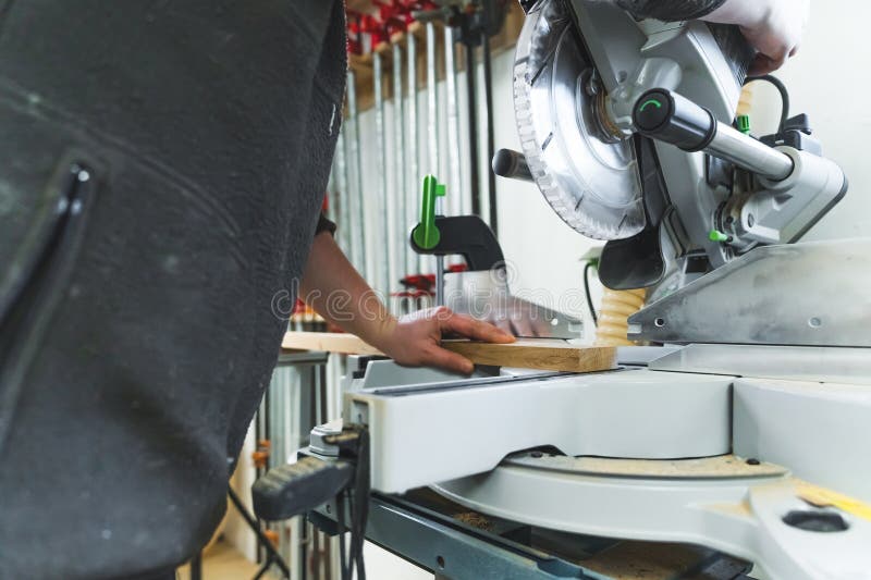 A Man Cutting Wood with Circular Saw Machine, No Face Stock Photo ...