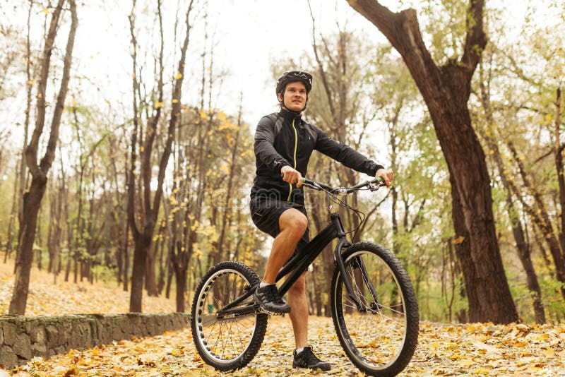 Man on Cycle in Autumn Park Stock Image - Image of bike, move: 88779305
