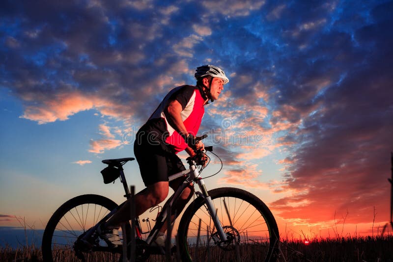 Man Cyclist with Bike on Sunset Stock Image - Image of evening ...