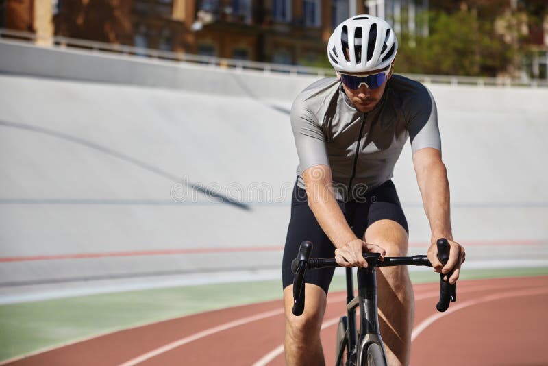 Man Cyclist Looking at Bicycle Speedometer or Cadence Sensors Reading ...