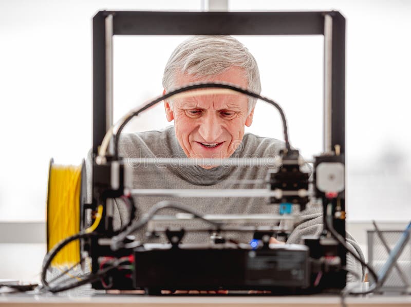 Man with 3D printer stock image. Image of scientist - 219774409