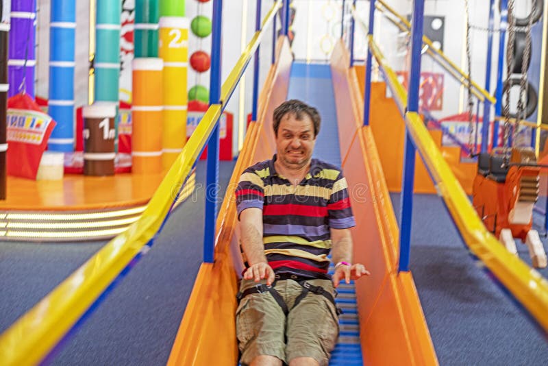 Man Dad Goes Down the Slide Attraction. Family Stock Image - Image of ...