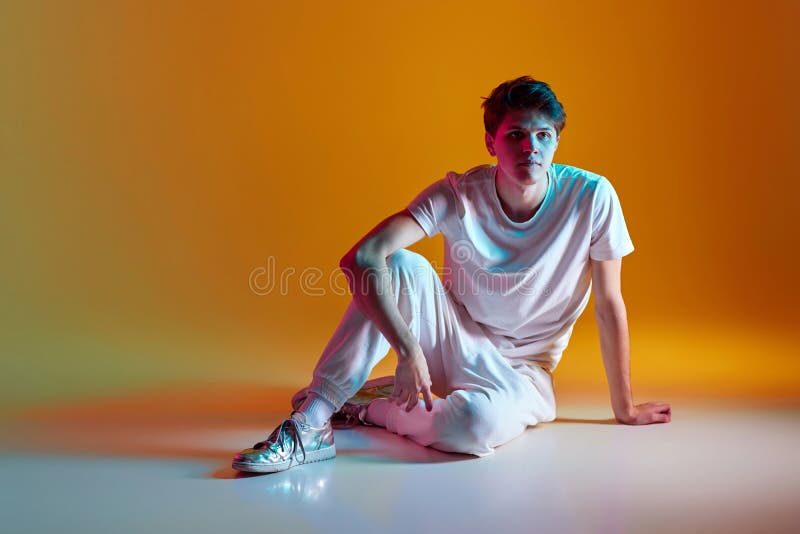 Man Dancing on Yellow Background. Neon Lighting Stock Photo - Image of ...