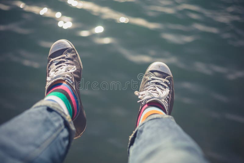 Man Dangling Feet Over Water Stock Photo - Image of outside, legs: 65453280