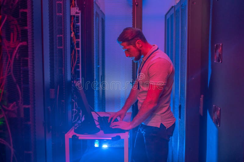 Man in Dark Server Room with Blue Backlight Stock Photo - Image of ...