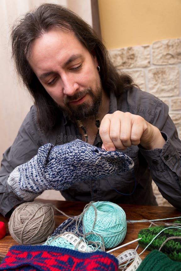 Man darn his socks himself stock photo. Image of people - 57171390