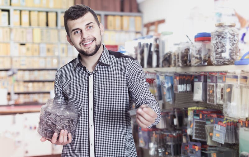 Man Deciding on Best DIY Details in Houseware Store Stock Image - Image ...