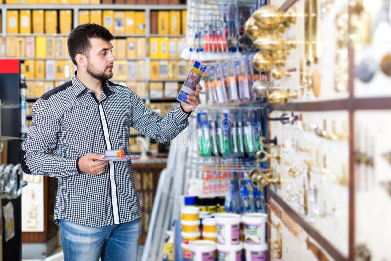 Man deciding on best glue stock image. Image of quality - 91994821
