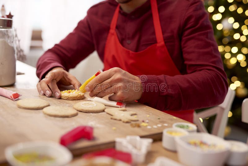Man Decorating Cookies in the Kitchen Stock Image - Image of icing ...