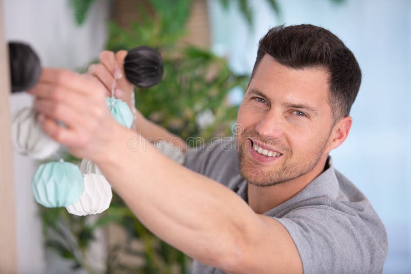 Man decorating house stock image. Image of oriental - 302960027