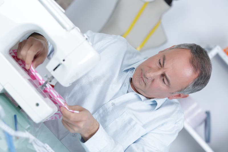 Man Threading Needle Stock Photos - Download 70 Royalty Free Photos