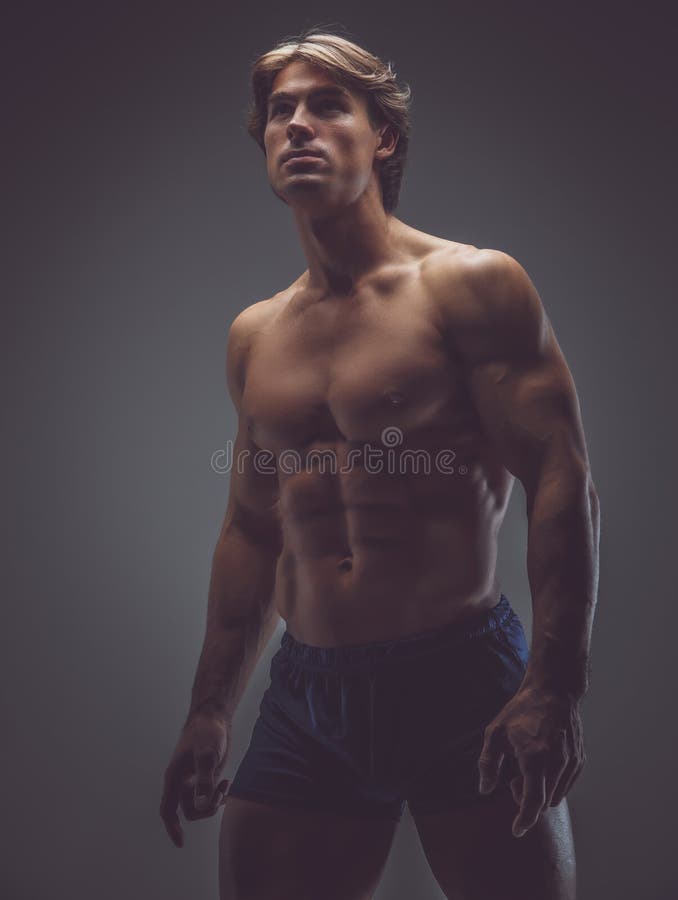 A man in a deep shadow. stock photo. Image of biceps - 107945688