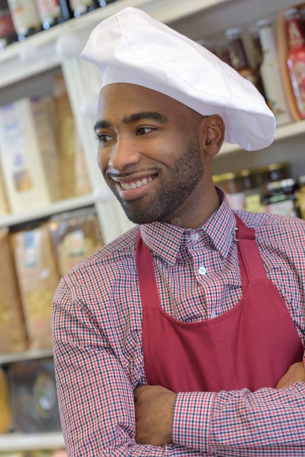 Man at Deli Counter Wearing Apron and Hat Stock Image - Image of staff ...