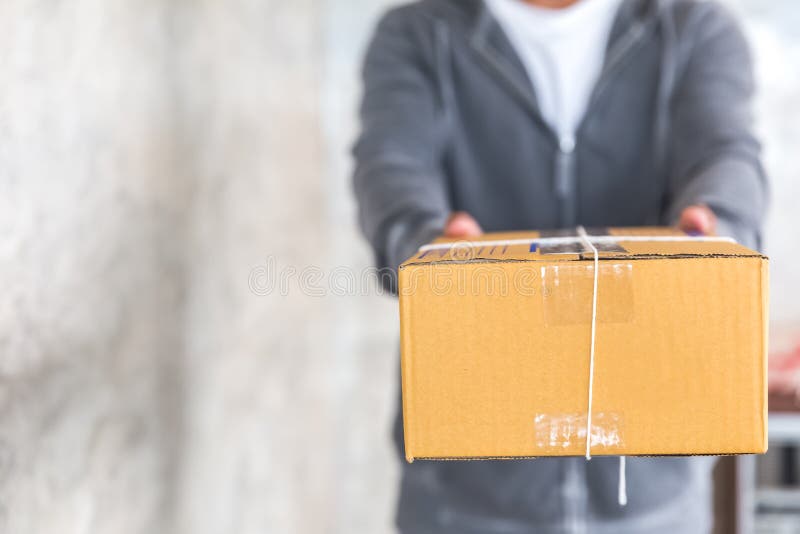 Man delivering a parcel stock photo. Image of carton - 107353174