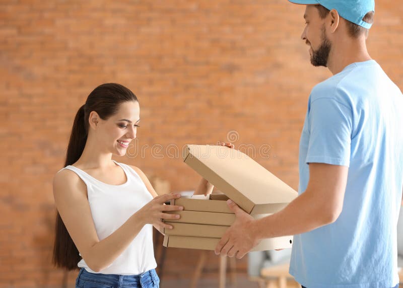 Man Delivering Pizza To Customer Indoors Stock Photo - Image of service ...
