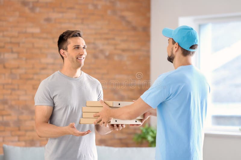 Man Delivering Pizza To Customer Indoors Stock Image - Image of ...