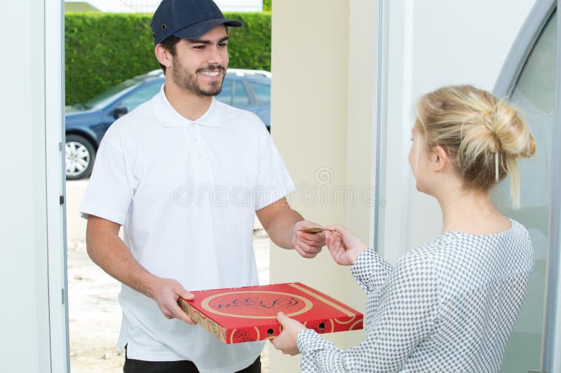 Man Delivering Pizza To Young Woman Stock Photo - Image of city ...