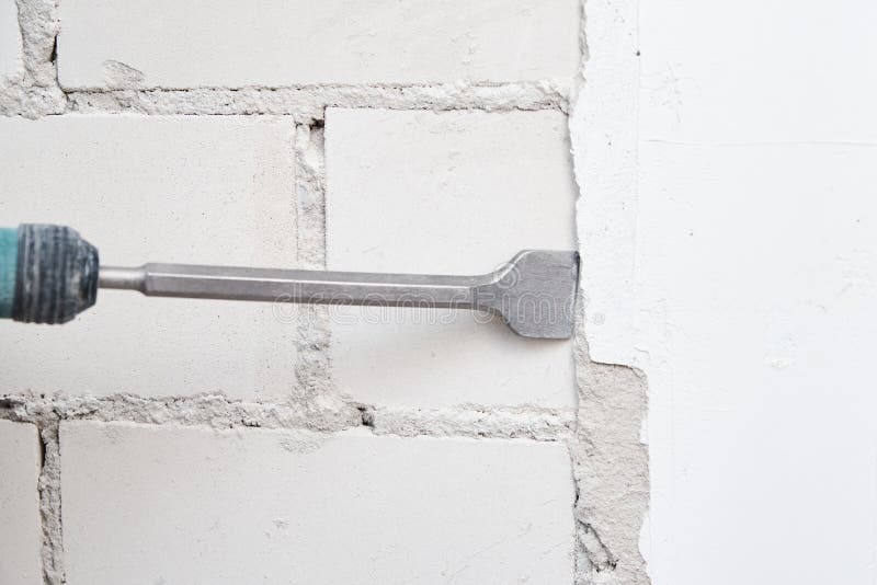 Man with Demolition Hammer Remove Stucco from Wall. Renovation Concept ...