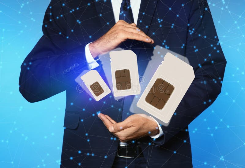 Man Demonstrating SIM Cards of Different Sizes on Blue Background ...