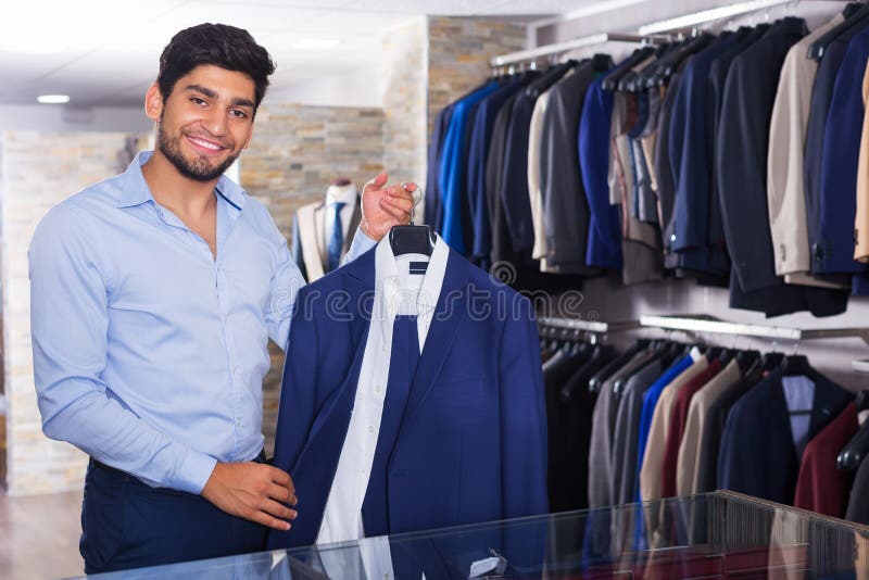 Man Demonstrating Suit in Shop Stock Photo - Image of clothing, retail ...