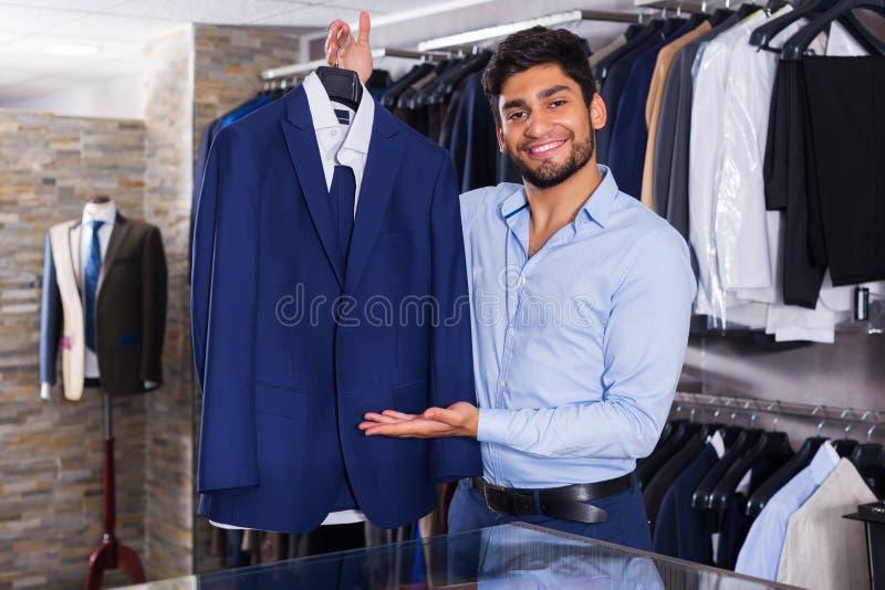 Man Demonstrating Suit in Shop Stock Photo - Image of deciding, shopper ...